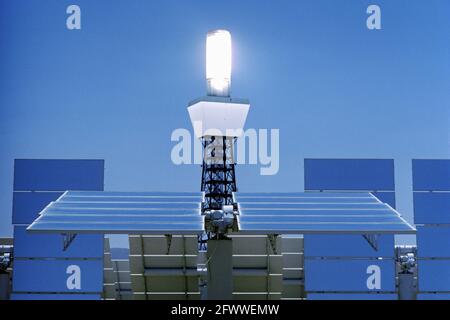 Solar power plant mirrors that focus the sun's rays upon a collector ...