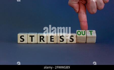 Stress or stress out symbol. Businessman turns cubes, changes words ...