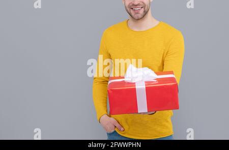 Its easy to give. Happy man cropped view give present Stock Photo - Alamy