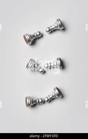 Different chess pieces on grey table against dark background Stock ...