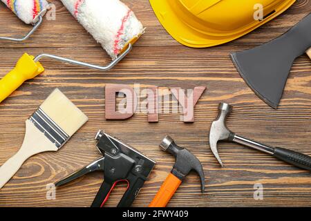Frame made of tools and word DIY on wooden background, closeup Stock ...