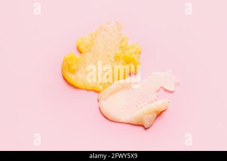 Samples of body scrub on color background Stock Photo - Alamy