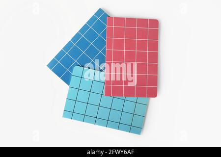 Checkered notebooks on white background Stock Photo - Alamy
