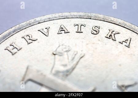 A fragment of croatian metal coin macro photo of one kuna. Selective ...