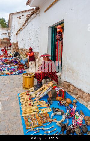 Traditional Andean music instruments for sale at a local market ...
