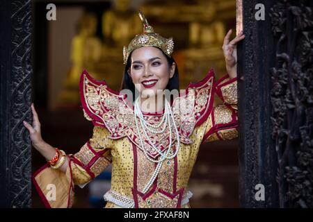 Burmese beautiful woman in antique Myanmar or Burma traditional national dress costume clothes ...