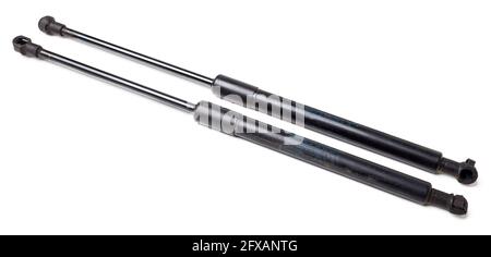 A pair of black metal hood shock absorbers with chrome elements ...