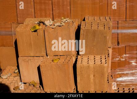 Load of bricks in stock for construction purpose Stock Photo - Alamy