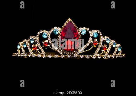 A closeup of a golden crown with a red gem. Traditional Orthodox ...