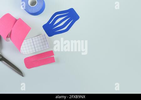 Rolls kinesiology tape in shape of an octopus and letter X for ...