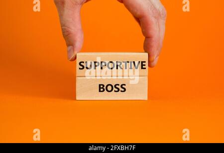 Supportive boss symbol. Wooden blocks with words 'Supportive boss' on ...