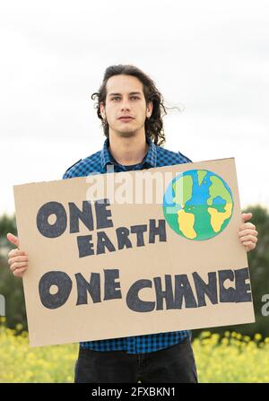A man holding climate change poster at cop26 in Glasgow, United Kingdom ...