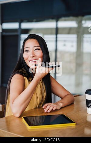 Asian women talking smartphone voice assistant communication technology ...
