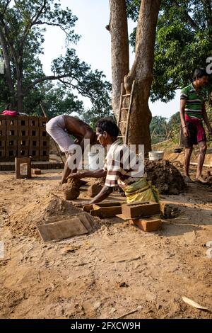 Men making clay bricks by hand in a rural village in Nayagarh, Odisha ...