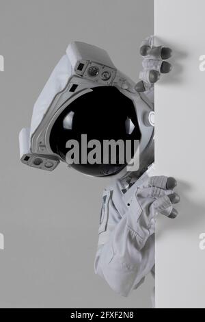 Astronaut holding an event banner, white background Stock Photo - Alamy