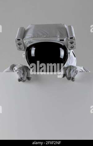 Astronaut holding an event banner, white background Stock Photo - Alamy