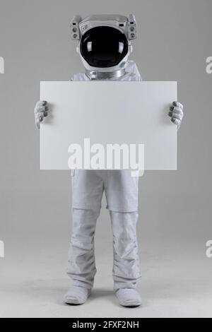 Astronaut holding an event banner, white background Stock Photo - Alamy