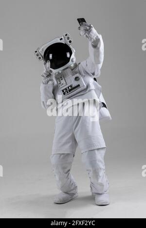 astronaut take selfie pictures, white background Stock Photo - Alamy