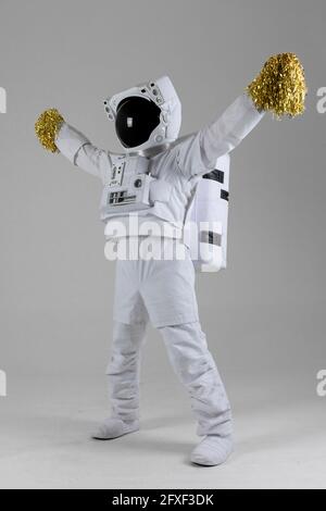 astronaut with cheer pompom, white background Stock Photo - Alamy