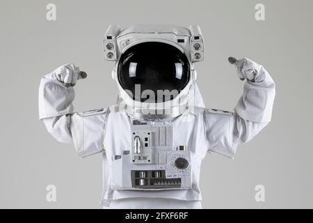 astronaut displaying muscles,white background Stock Photo - Alamy