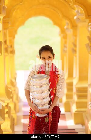 Burmese beautiful woman in antique Myanmar or Burma traditional national dress costume clothes ...