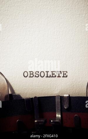 Obsolete word written with a typewriter Stock Photo - Alamy