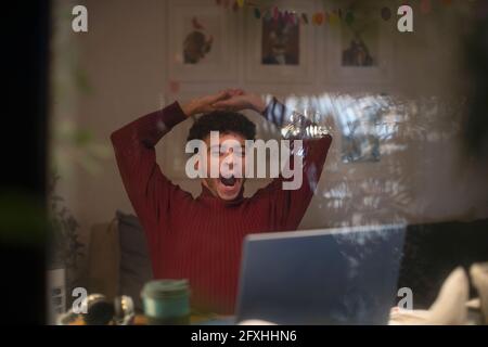 a man in the office, tired from work and shaggy, sits in front of a ...