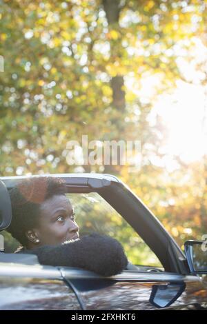 Woman riding in convertible Stock Photo - Alamy