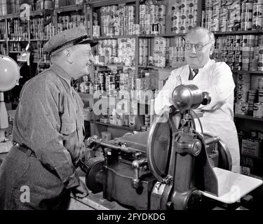 Cheerful smiling supermarket workers in fruit and vegetables section ...