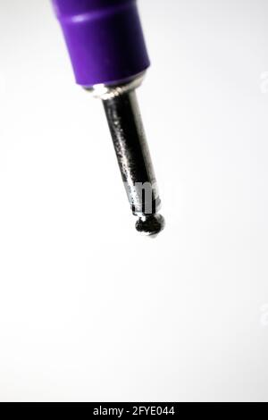 Macro Closeup of Tip of Quarter Inch Jack Connector with Purple Rubber ...