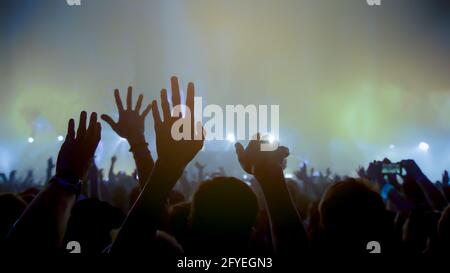 Concert hall crowded with clapping people Stock Photo - Alamy