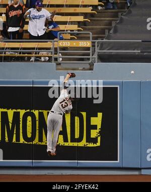 San Francisco Giants' Austin Slater, right, kneels during the national ...
