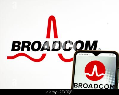 In this photo illustration, a Broadcom logo is seen displayed on TV ...