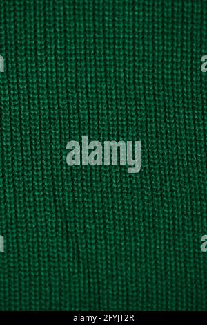 Vertical shot of green fabric matting used for wallpaper or background ...