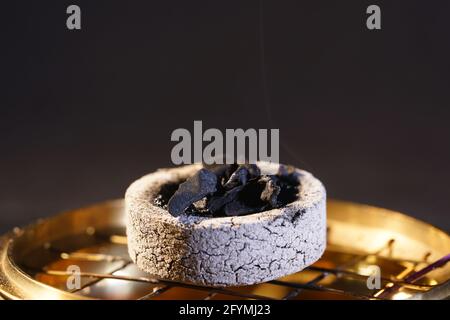 Round stone structure with coal pieces Stock Photo - Alamy