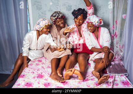 Happy women in dressing gowns and hair bonnets Stock Photo - Alamy