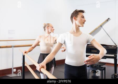 Ballet lesson in the studio. Choreographer plays the piano Stock Photo ...