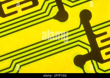 Vibrant coloured abstract macro shot of an opaque printed circuit board ...