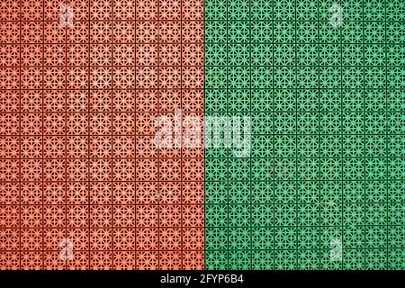 Green and orange rubber coating for playgrounds. EPDM rubber granules ...