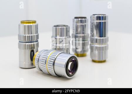 Many of lenses different of magnification on a white background. Close ...