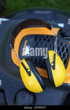 Peltor hearing protection on a lawn mower Stock Photo - Alamy