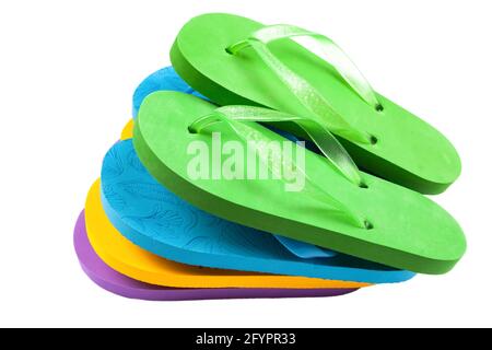 several multi colored rubber flip flops on a white background Stock ...