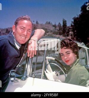 Elizabeth Taylor, with husband Michael Wilding, holding their sons ...