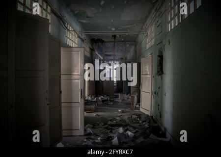 Picture of a damaged interior of an abandoned office building with a ...