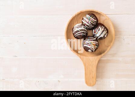 fancy chocolate ball on wood plate Stock Photo - Alamy