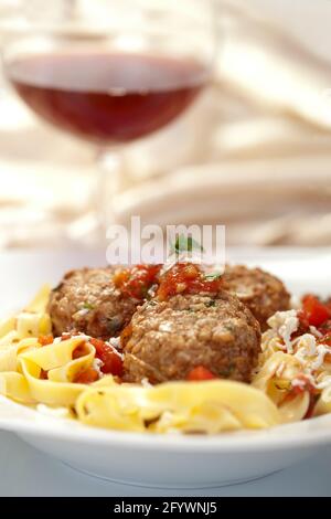 Homemade tagliatelle with sauce and meatballs cooked on a disc Stock ...