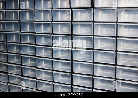Plastic cells in the small change box close up Stock Photo - Alamy