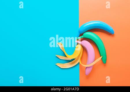 Creative composition with painted bananas on color background Stock ...