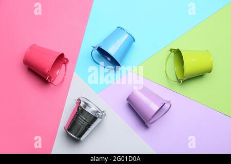 Different buckets on color background Stock Photo - Alamy