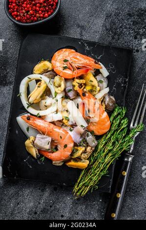 seafood set of prawns, octopus, mussels, squid rings with lime Stock ...